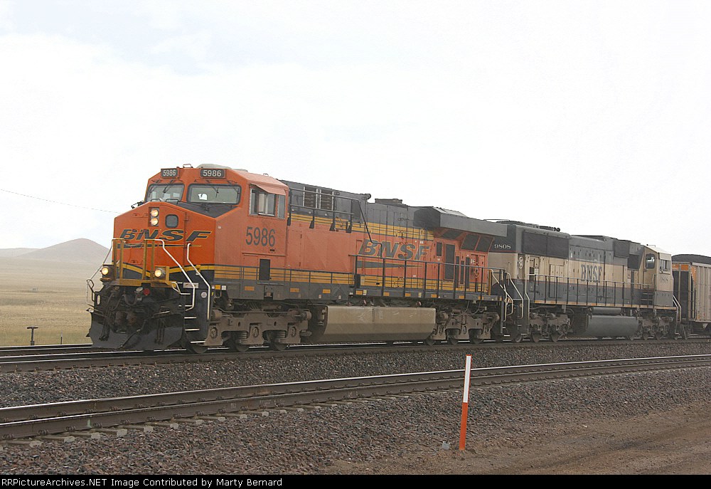 BNSF 5986 and 9808 Haul Coal in the Rain
